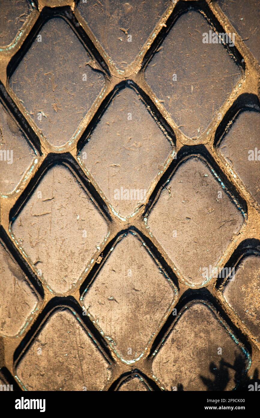 Diamond-shaped tread for a car tire in warm colors Stock Photo - Alamy