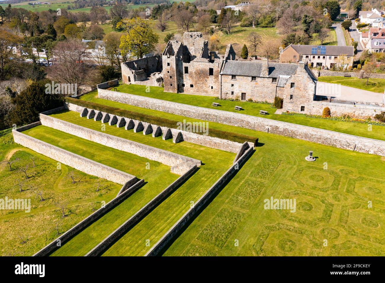 Aerial view from drone of Aberdour Castle (closed during lockdown) and ...
