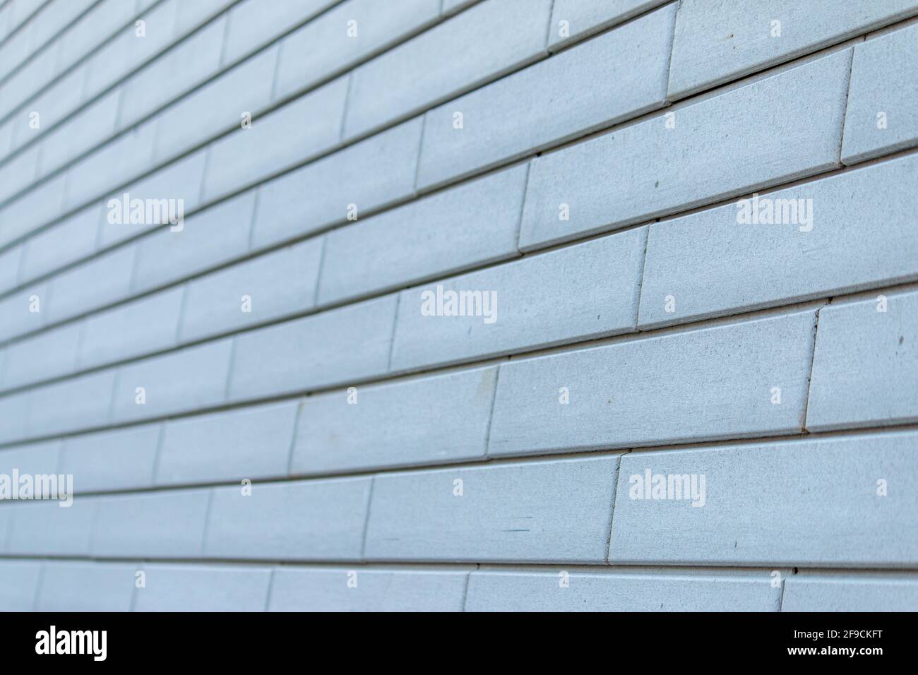 Surface of long bricks at an angle view Stock Photo - Alamy