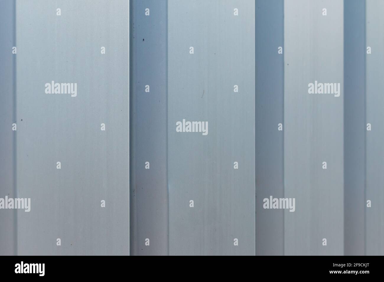 Gray metal striped wall receding into the distance Stock Photo - Alamy