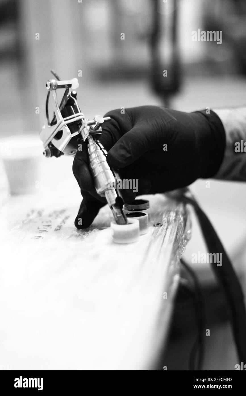 Hand holding needle Black and White Stock Photos & Images - Alamy