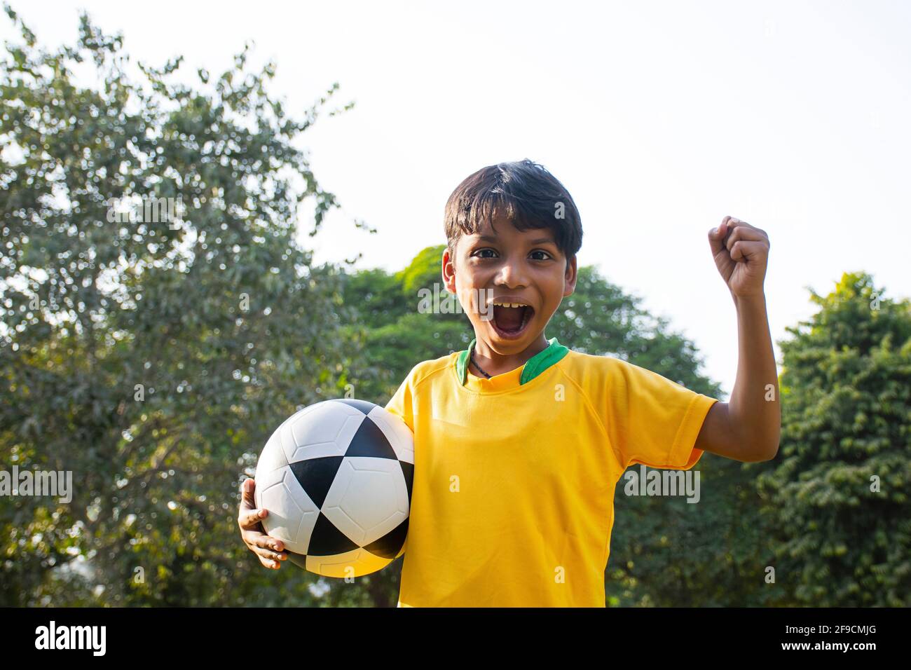 Soccer player shouting on the park Stock Photo - Alamy