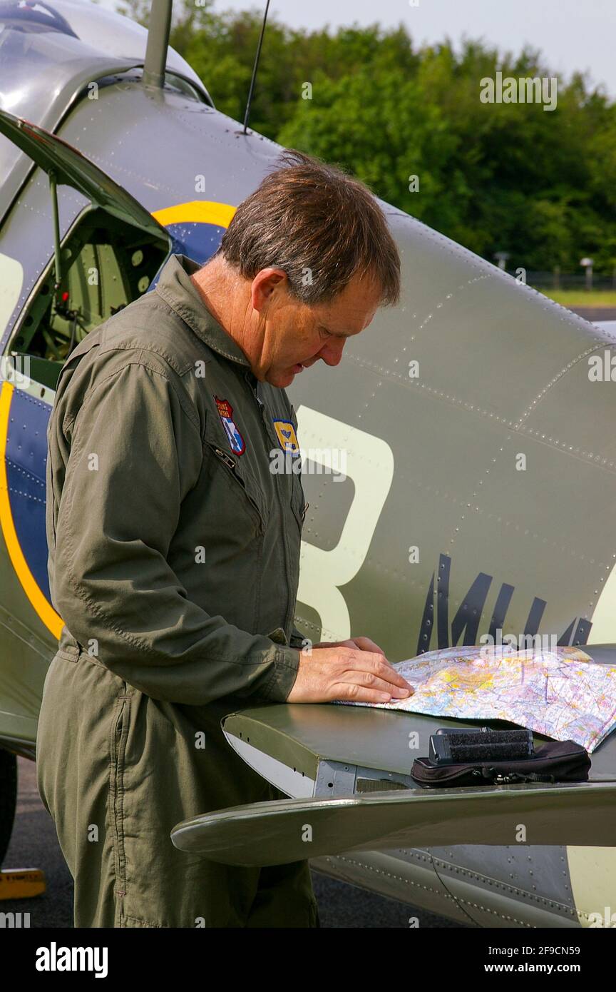 Pilot Nigel Lamb preparing for flight in Second World War fighter plane ...