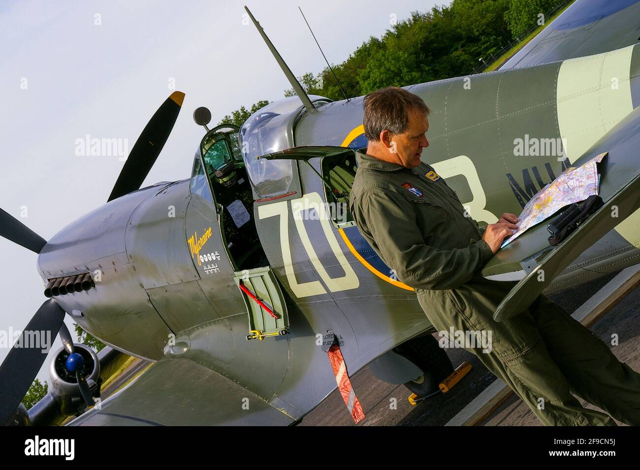 Pilot Nigel Lamb preparing for flight in Second World War fighter plane ...
