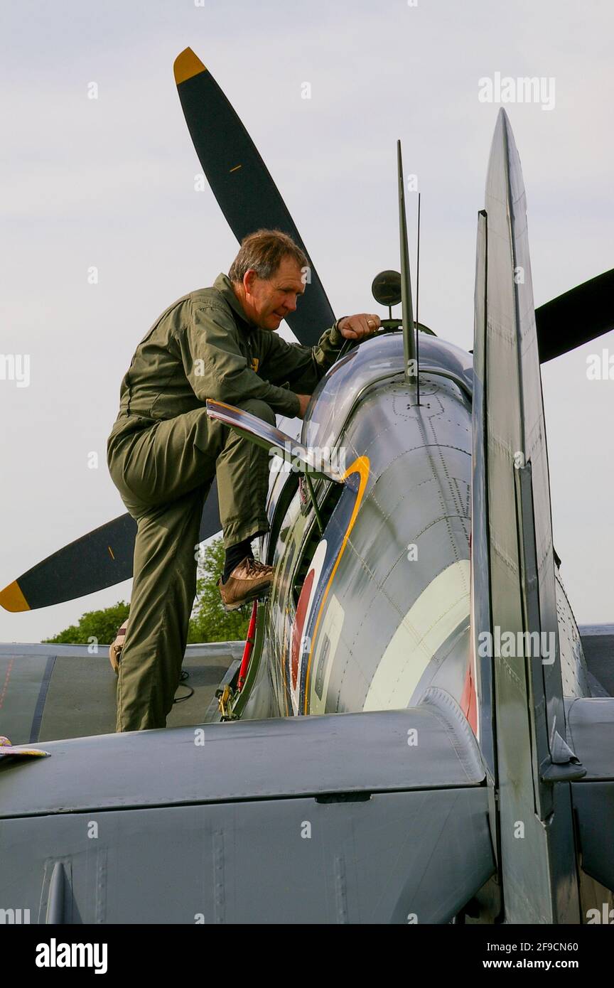 Pilot Nigel Lamb preparing for flight in Second World War fighter plane ...