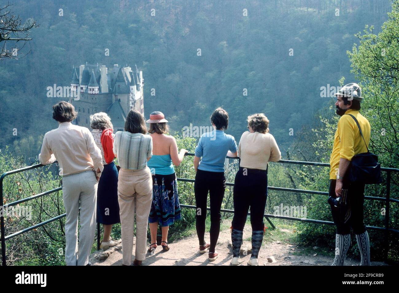 Group of people sightseeing at Eltz Castle in 1981, Moselkern ...