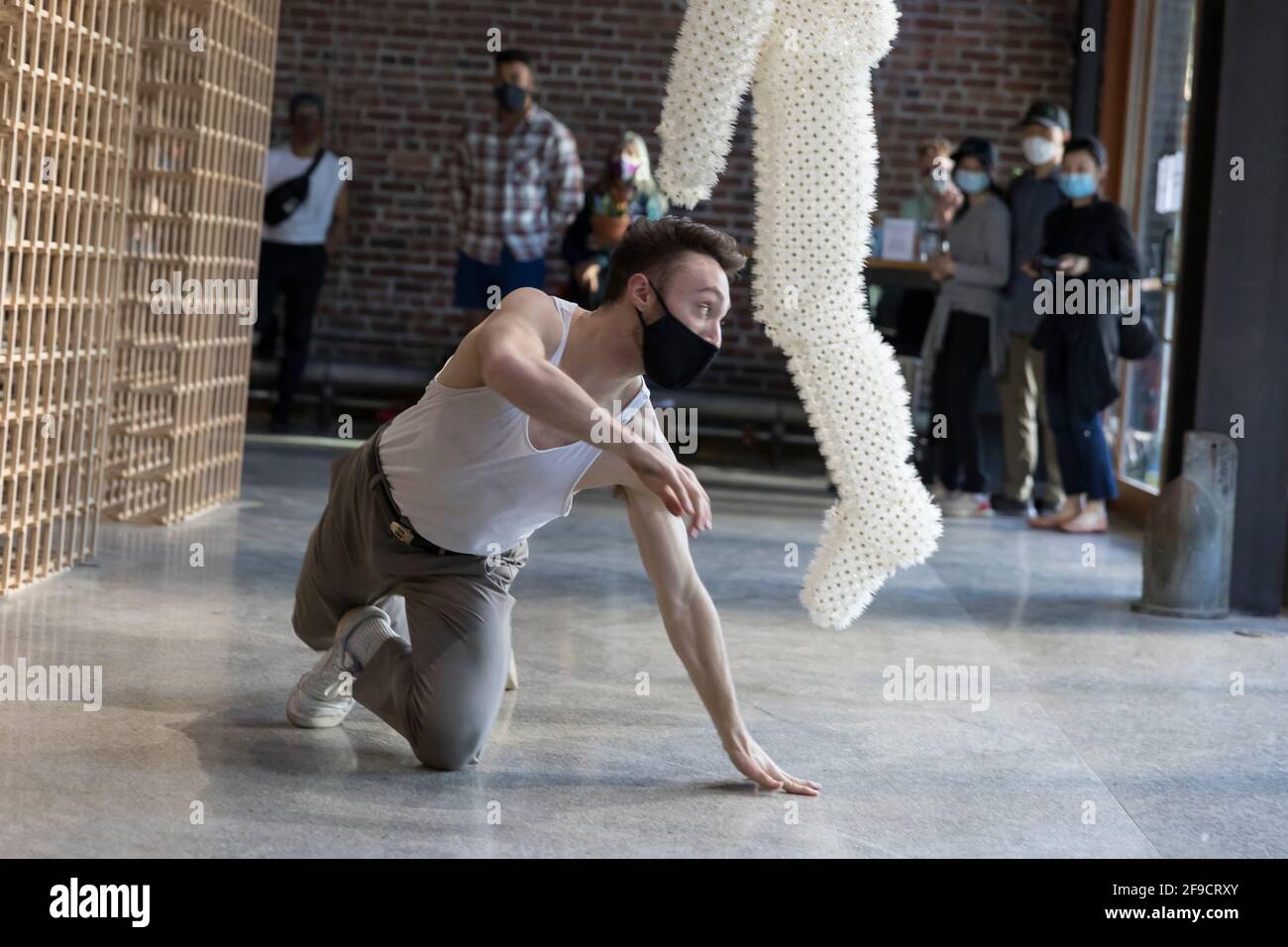Dancer Michael Arellano performs a dance solo amid Casey Curran’s ...