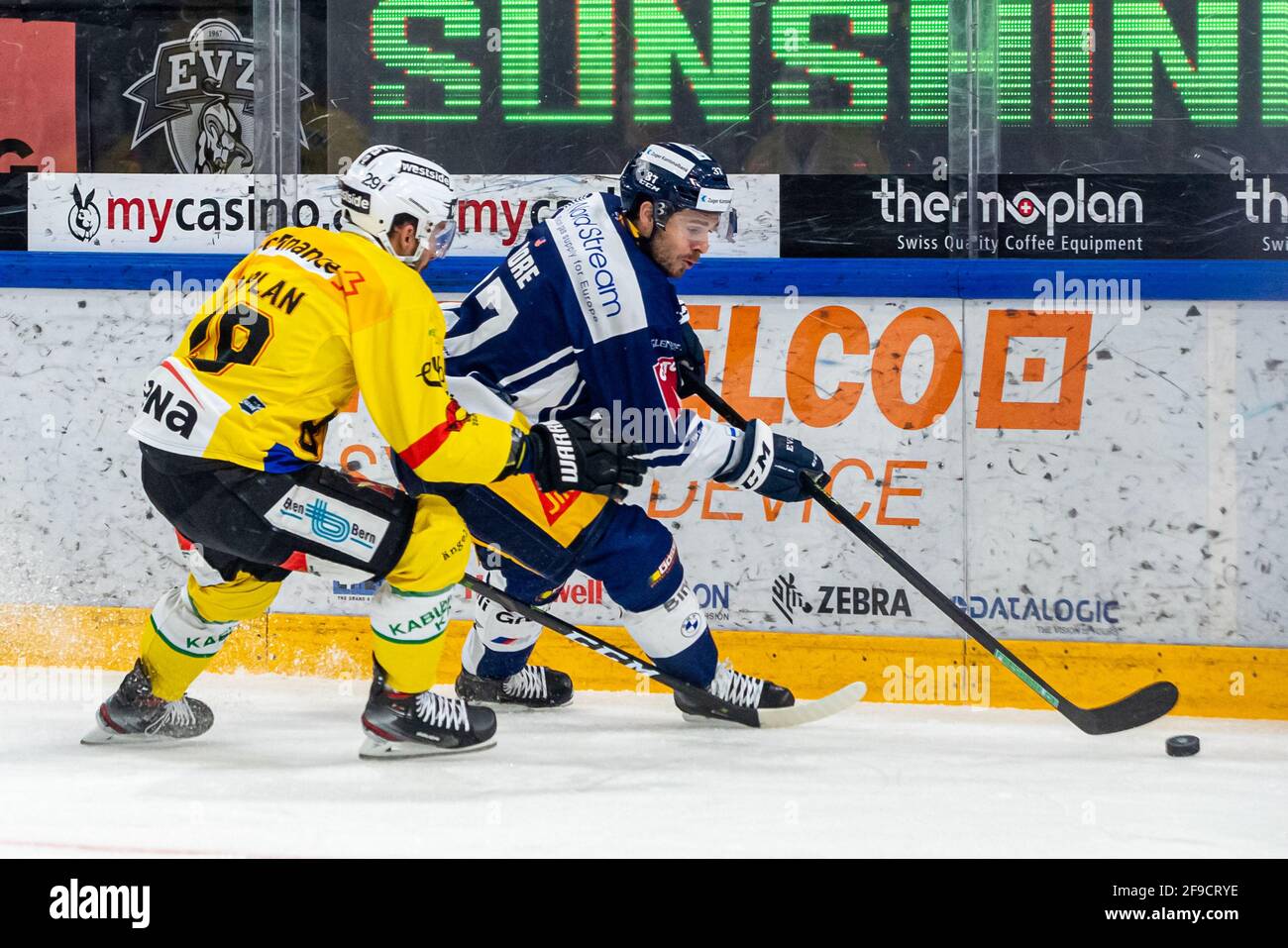 Duel between # 29 Vincent Praplan (Bern) and Nick Shore # 37 (EV Zug ...