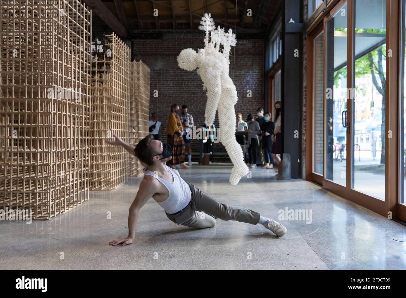 Dancer Michael Arellano performs a dance solo amid Casey Curran’s ...