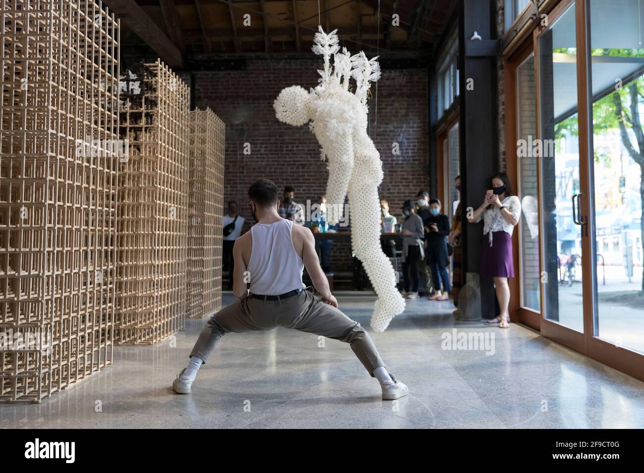 Dancer Michael Arellano performs a dance solo amid Casey Curran’s ...