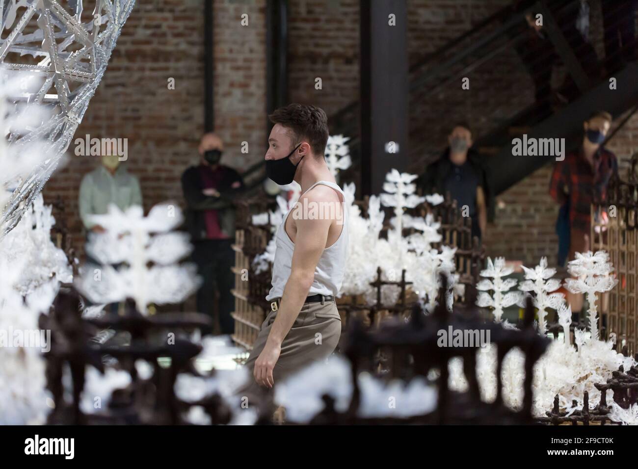 Dancer Michael Arellano performs a dance solo amid Casey Curran’s ...