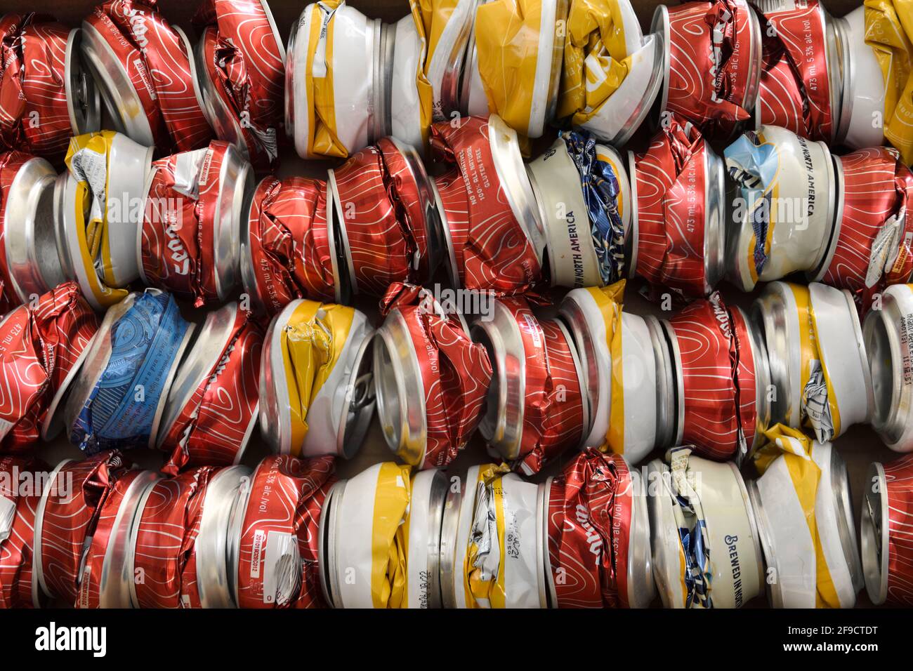 Side view of 40 crushed aluminum cans for beer and cider beverages ...