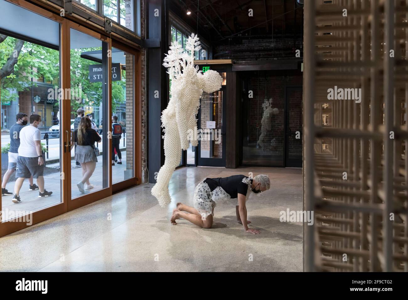 Dancer Karl Watson prepares for a performance amid Casey Curran’s ...