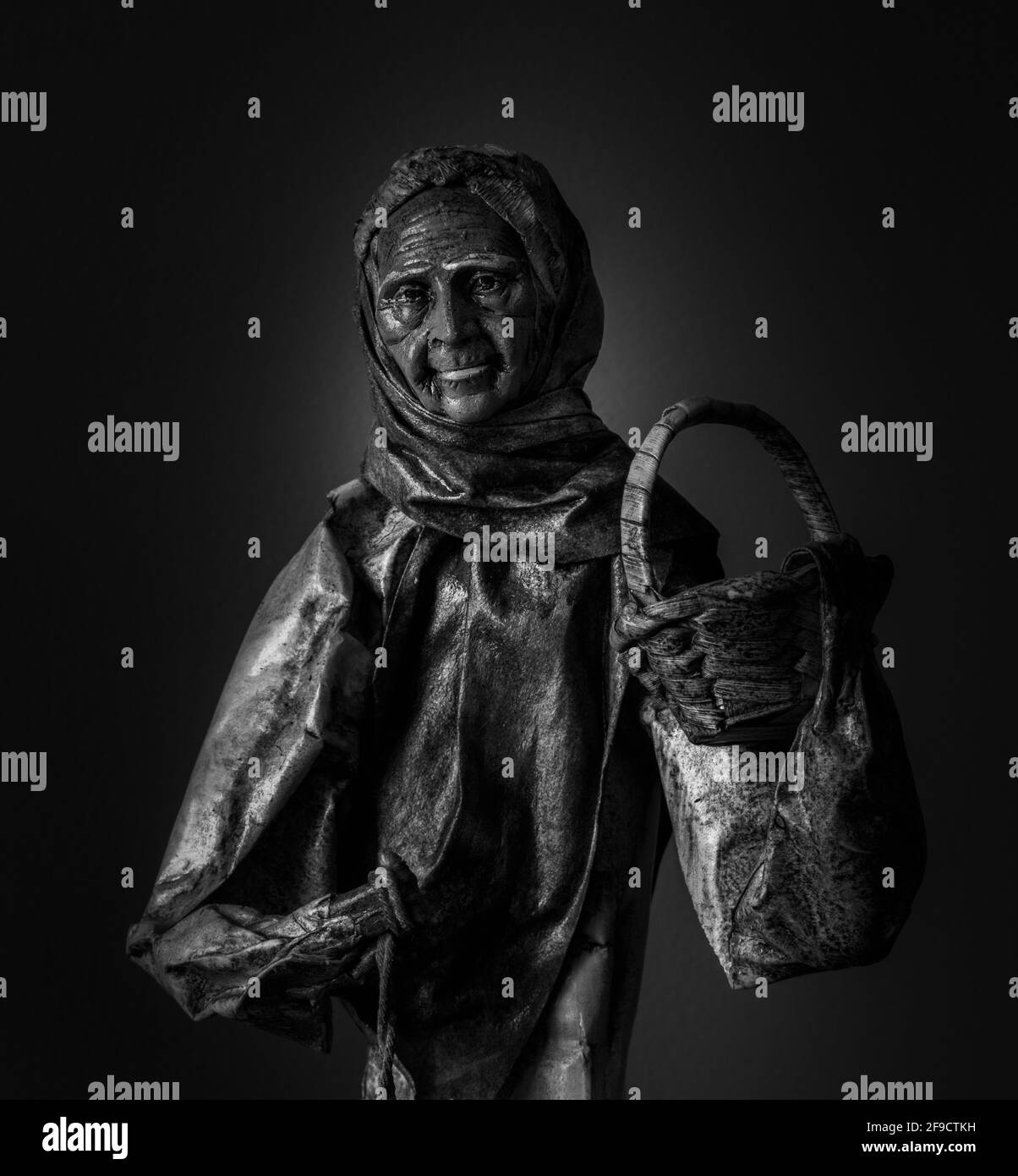 A black and white image of an old woman's face and kerchief made out of ...