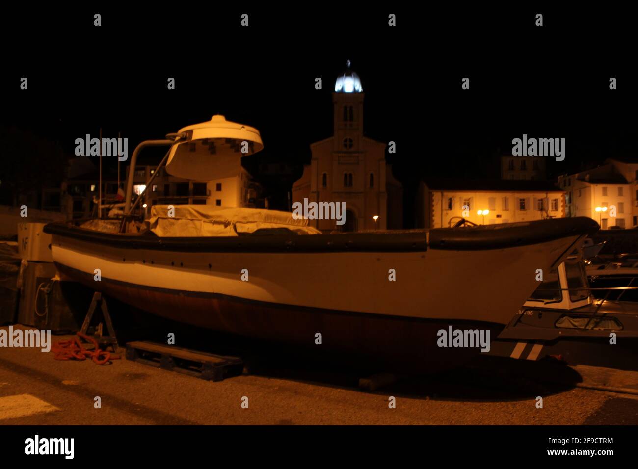 Lantern fishing vessel at night in a port Stock Photo - Alamy
