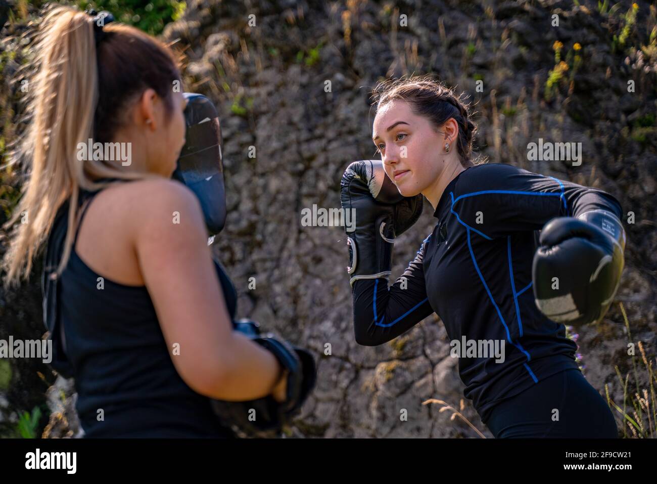 Pretty young girls practices boxing Stock Photo - Alamy