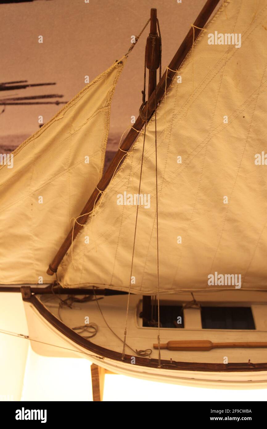 Traditional Mediterranean fishing barque skiff boat with lateen sail ...