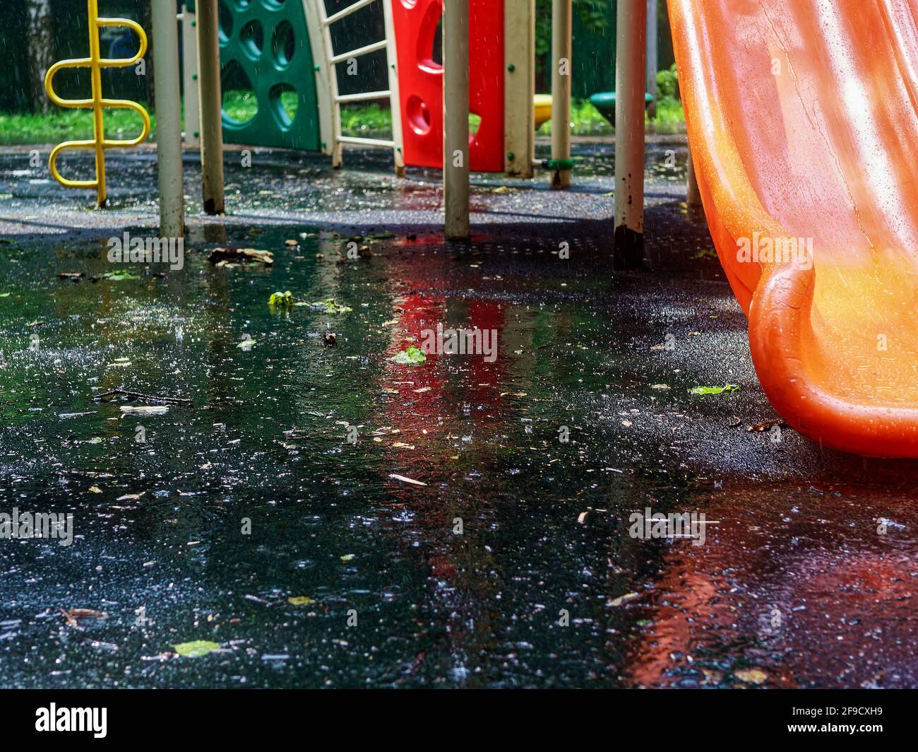 Playground after heavy rain in summer Stock Photo - Alamy