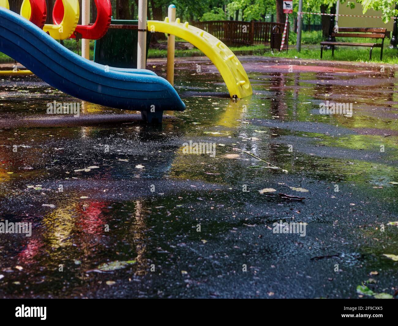 Playground after heavy rain in summer Stock Photo - Alamy