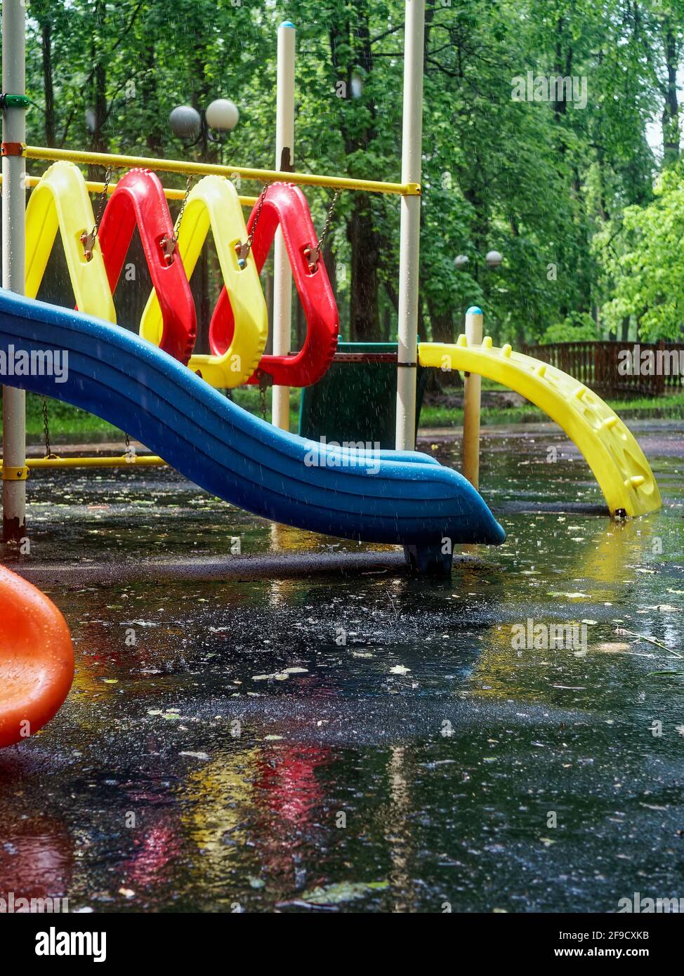 Playground after heavy rain in summer Stock Photo - Alamy