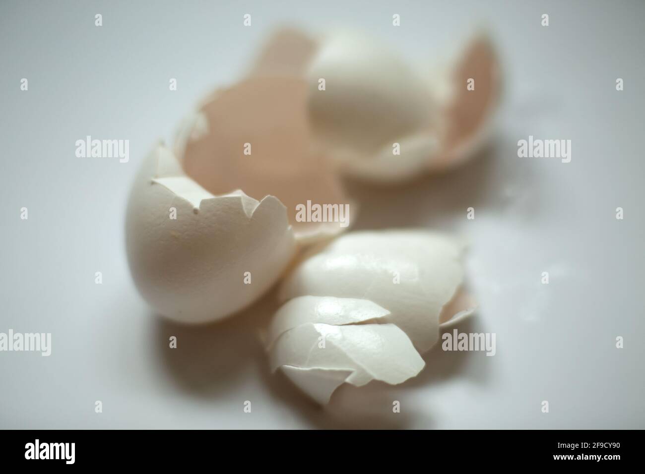 Leftover eggshell close-up on a white background Stock Photo - Alamy