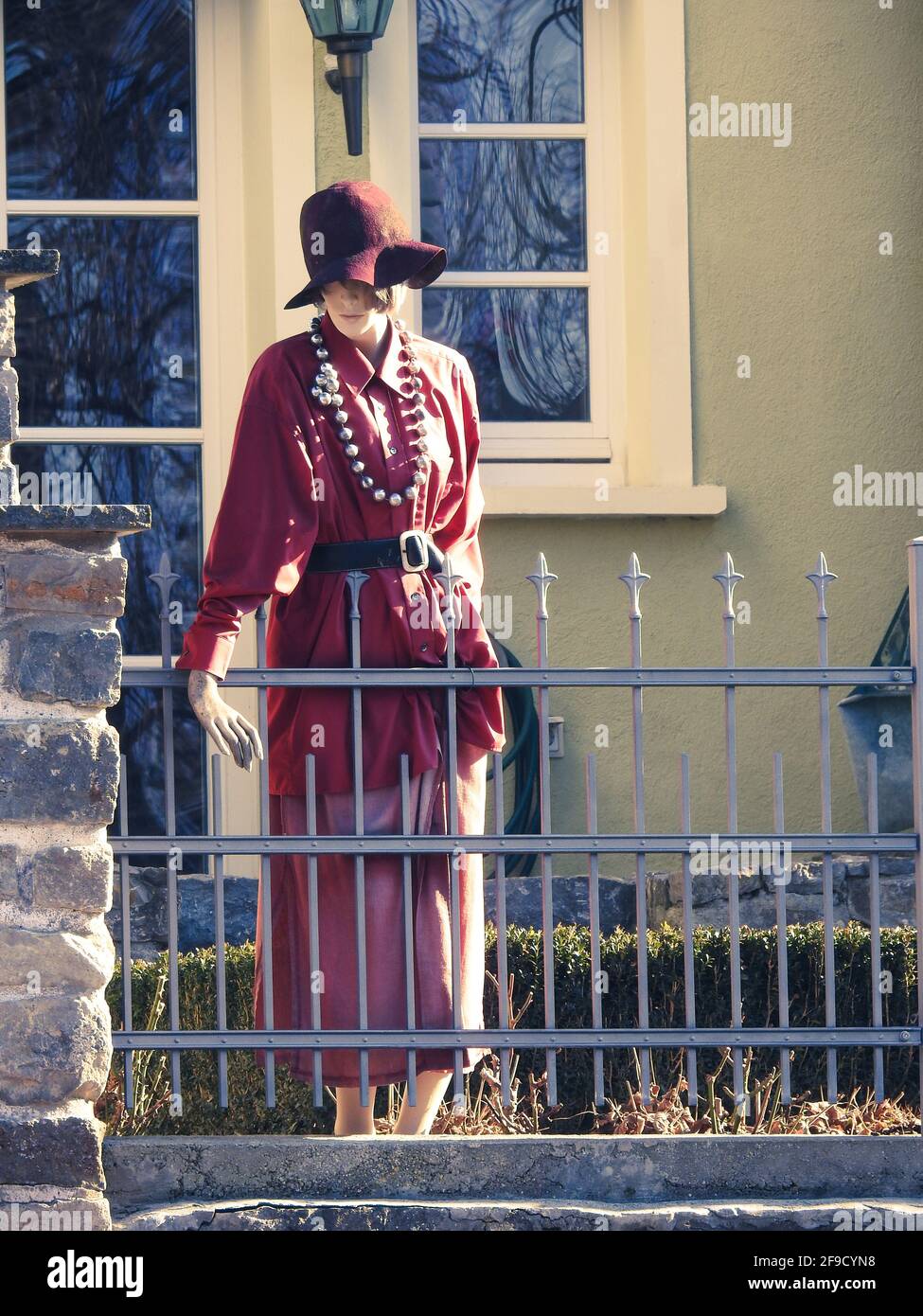 Disguised human woman figure on the balcony Stock Photo - Alamy