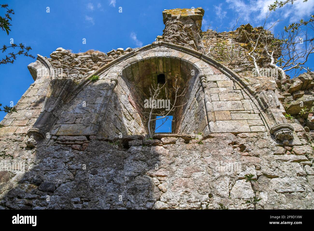 The ancient ruins of the upper window arches and vaulted walls of the ...