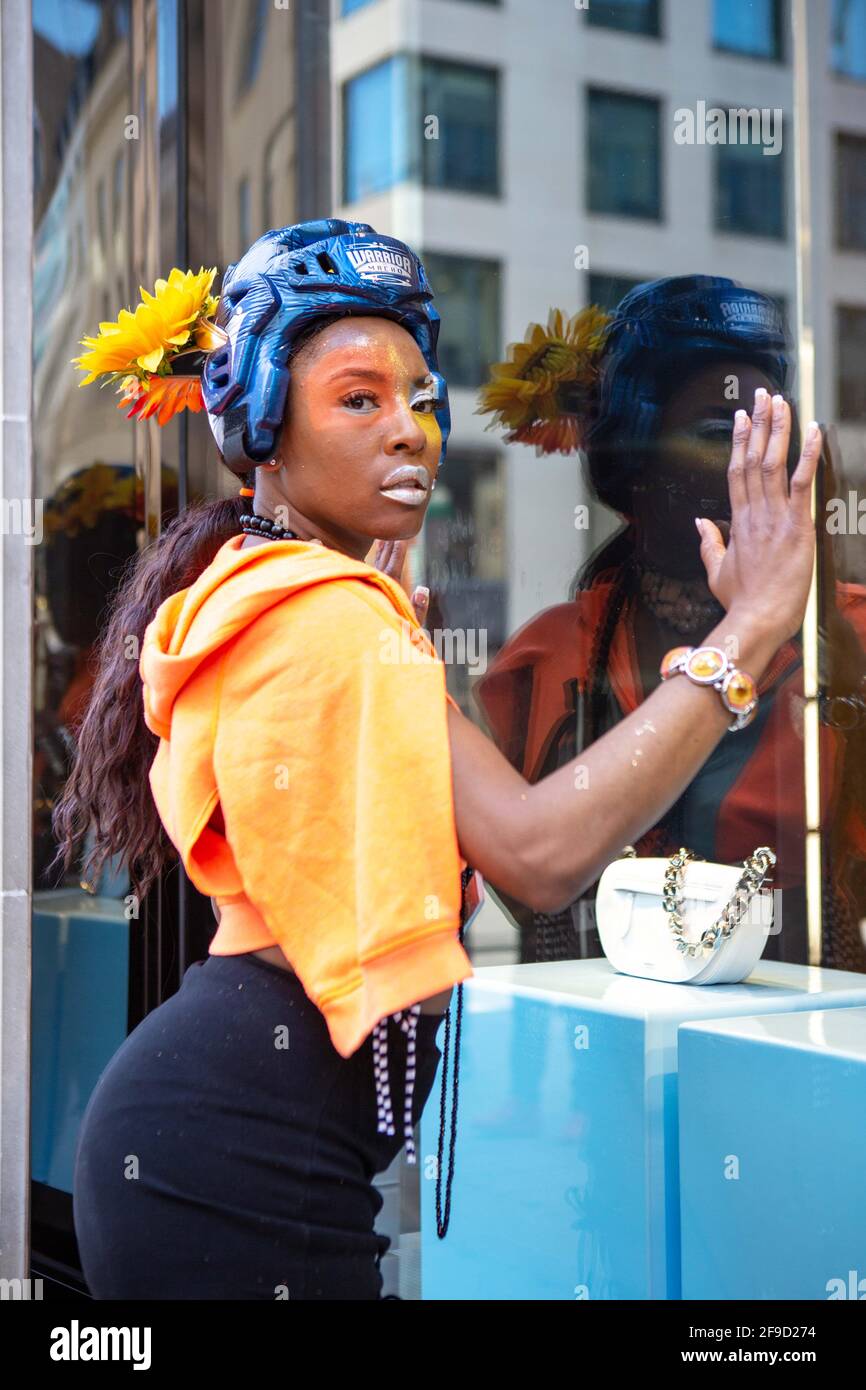 A model showcases Pierre Garroudi's latest colorful collection at one ...