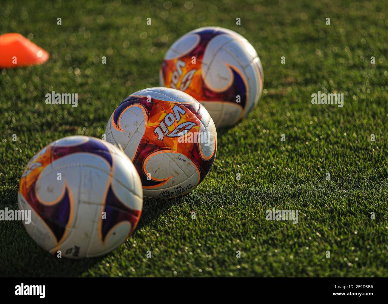 Soccer balls in grass or natural grass of the Hereo de Nacozari Stadium ...