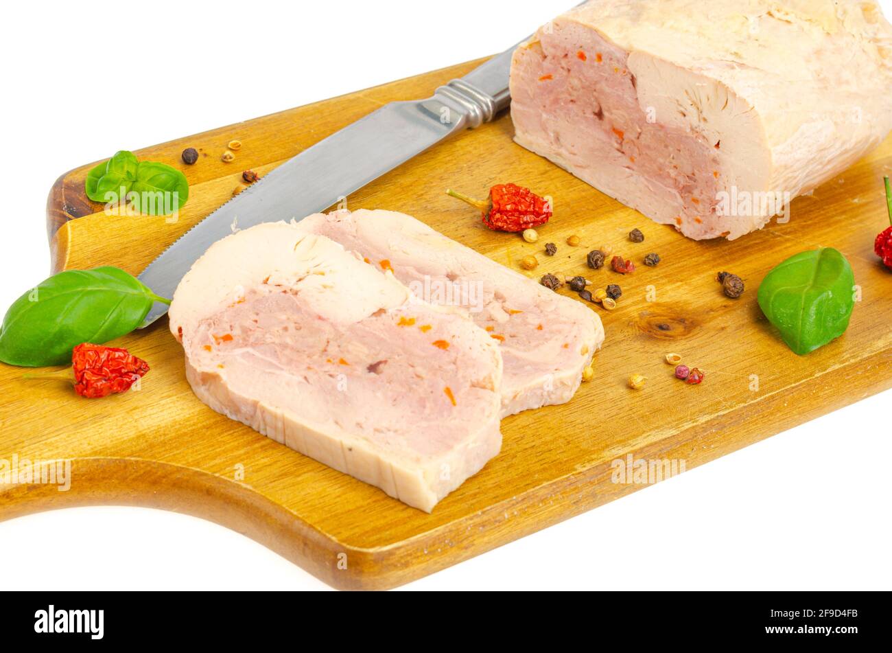 Homemade chicken fillet meat roll with vegetables and spices. Studio ...