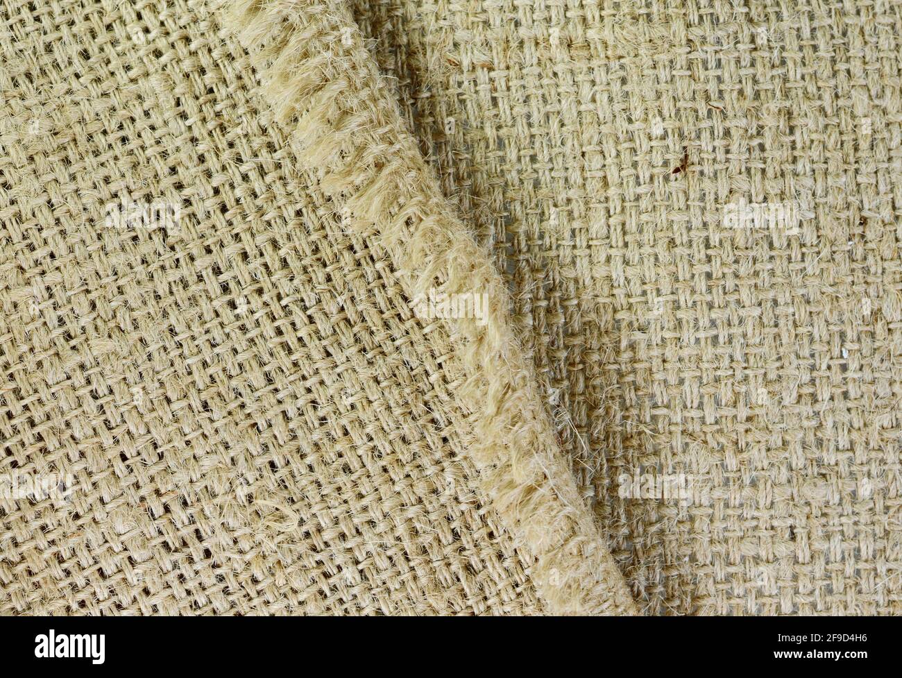 Closeup of burlap hessian sacking. Texture canvas fabric as background. Light natural linen ...