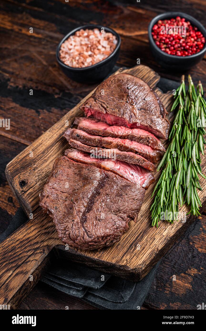 Fried Top Blade or flat iron roast beef meat steaks on wooden board ...