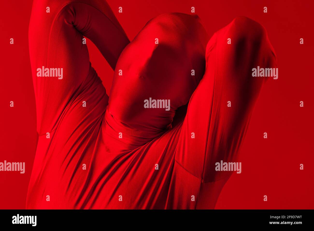 Crazy screaming red man on a red background. figure in a leotard ...