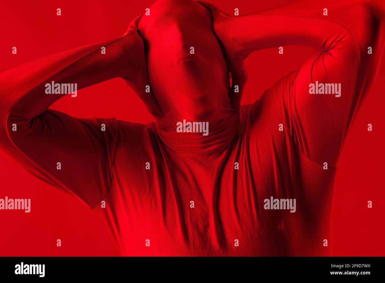 Crazy screaming red man on a red background. figure in a leotard ...