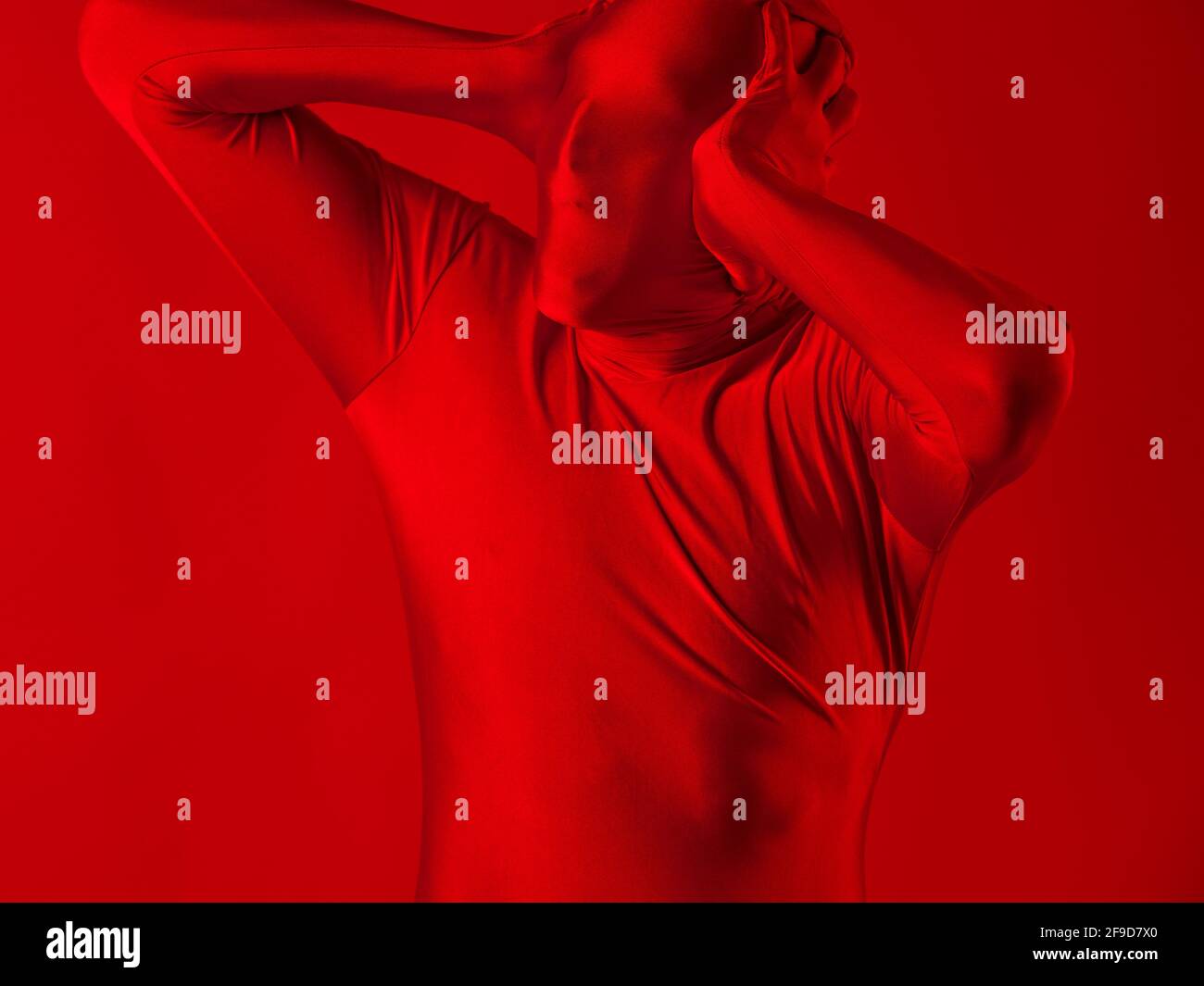 Crazy screaming red man on a red background. figure in a leotard ...