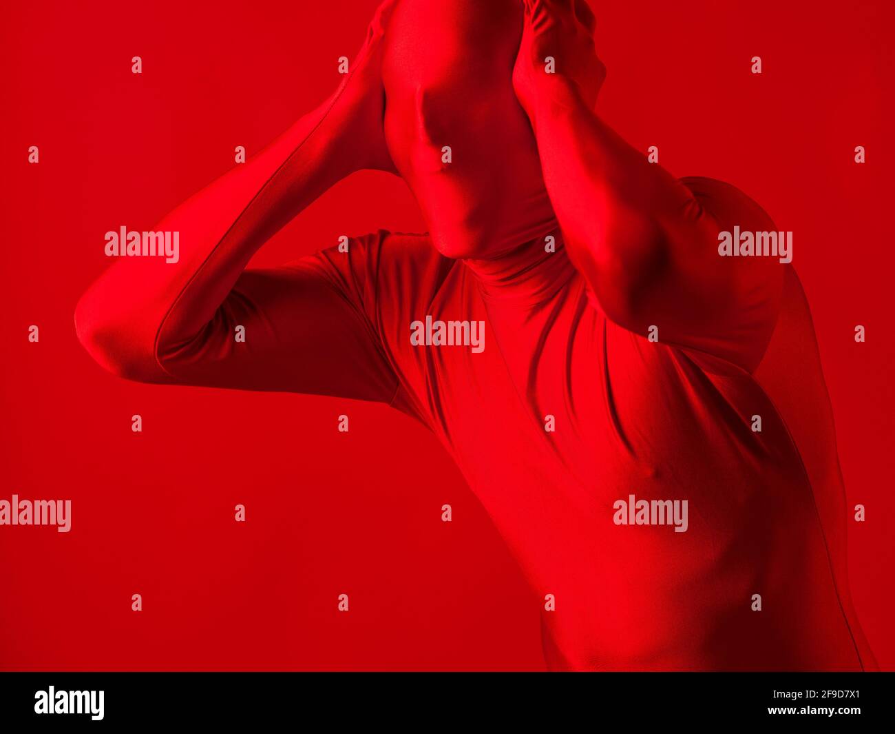 Crazy screaming red man on a red background. figure in a leotard ...