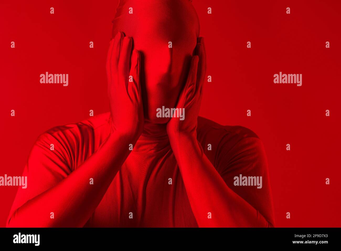 Crazy screaming red man on a red background. figure in a leotard ...