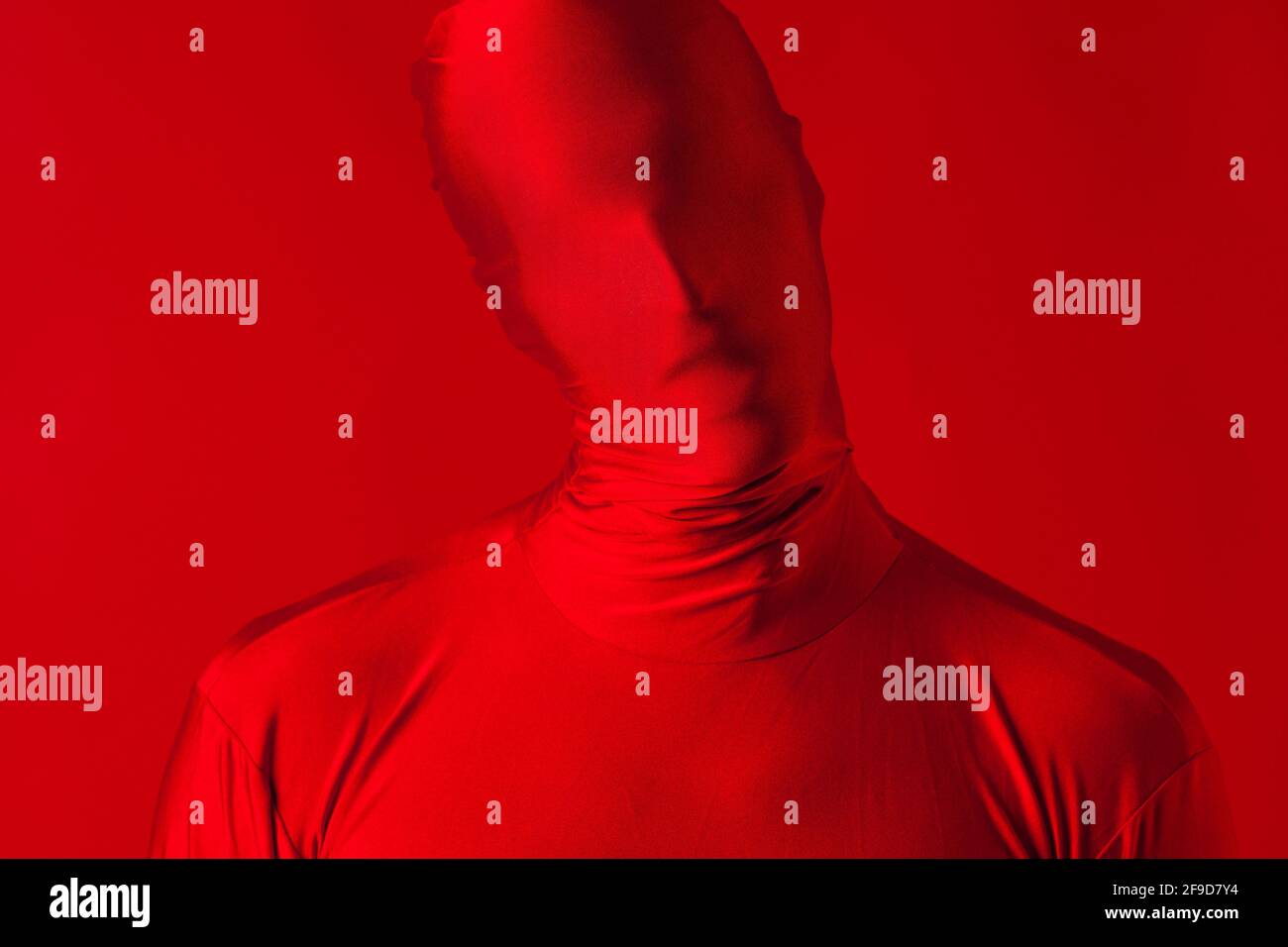 Crazy red man on a red background. figure in a leotard covering the ...