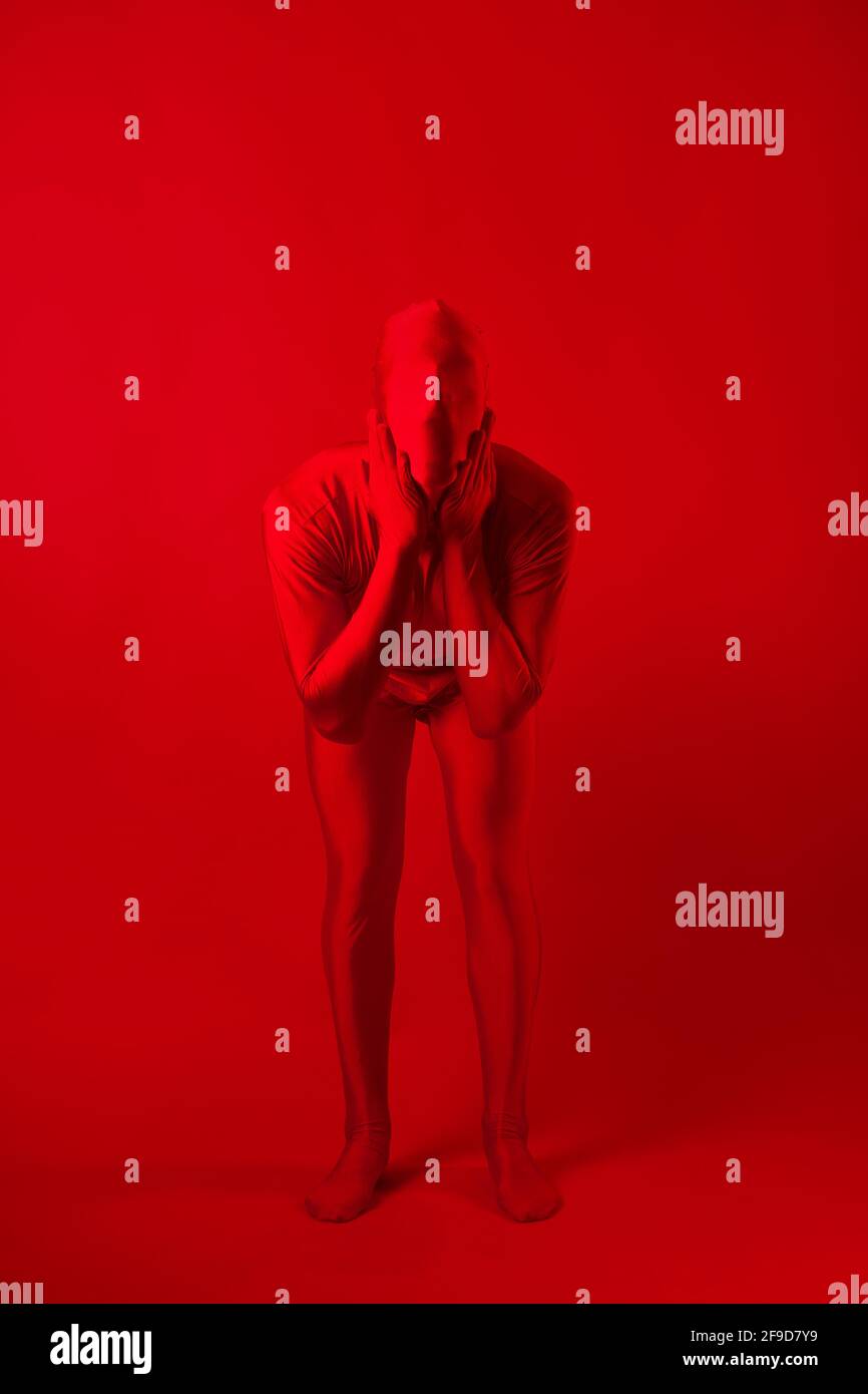 Crazy red man on a red background. figure in a leotard covering the ...