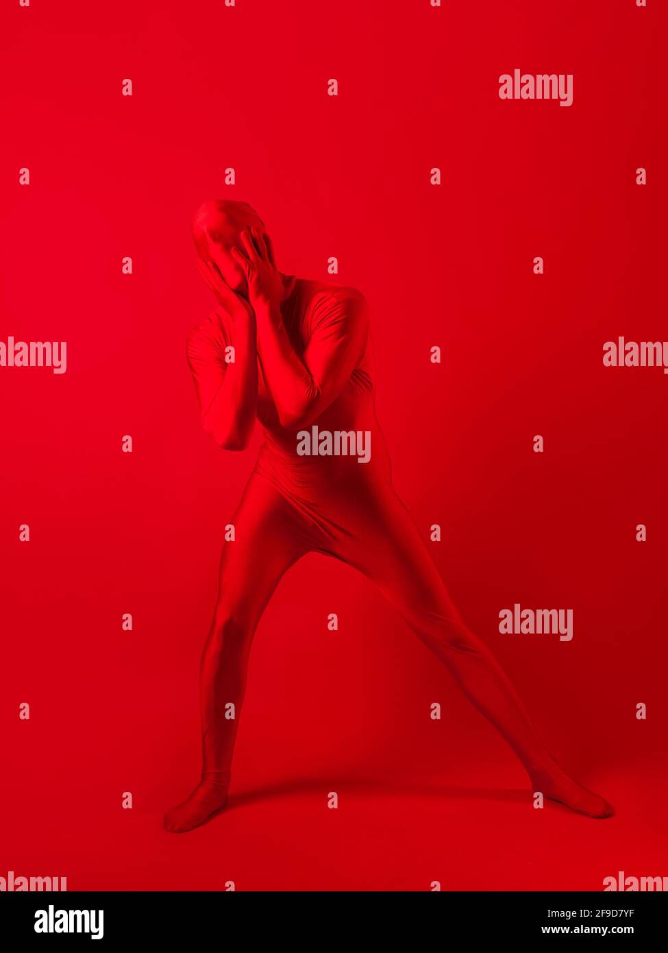 Crazy red man on a red background. figure in a leotard covering the ...