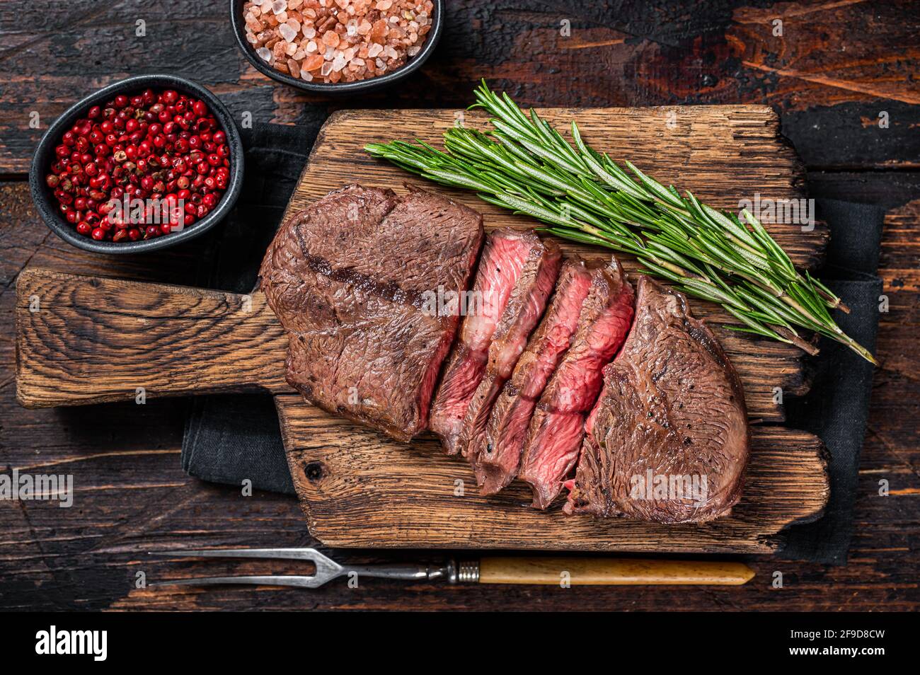 Fried Top Blade or flat iron roast beef meat steaks on wooden board ...