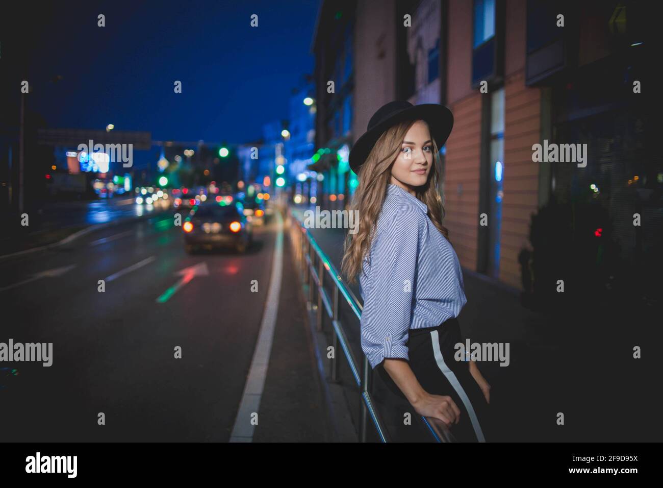 Beautiful Bosnian Caucasian woman in a hat posing on the street with ...