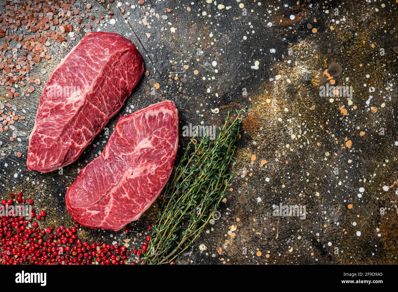 Raw Shoulder Top Blade cuts, beef meat steaks. Brown background. Top ...