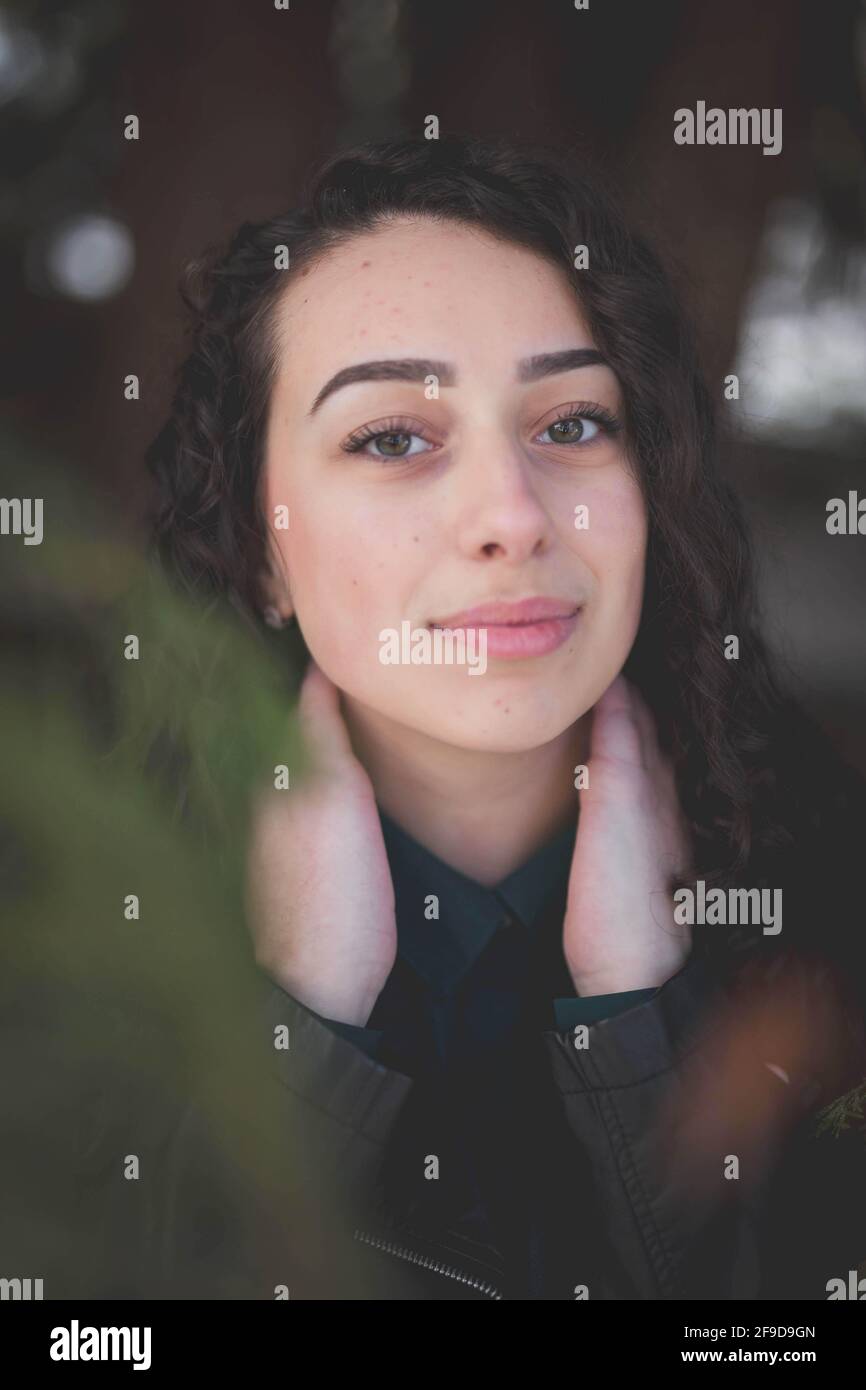 Beautiful curly Bosnian Caucasian woman in a black leather jacket ...