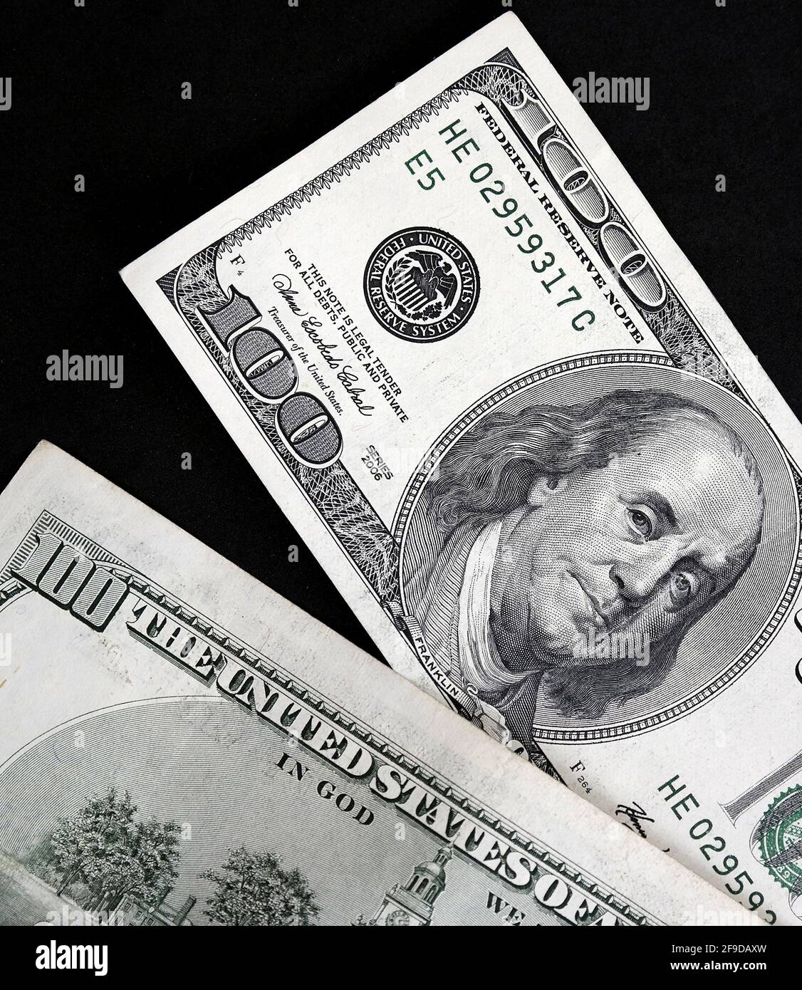 100 US dollars on a black background, the world market and 100 usd ...