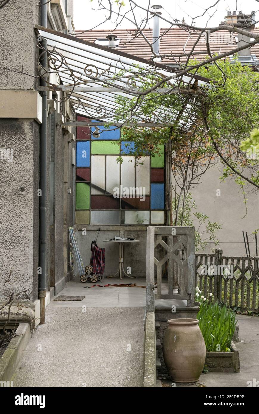 Charming courtyard with glass awning Stock Photo - Alamy