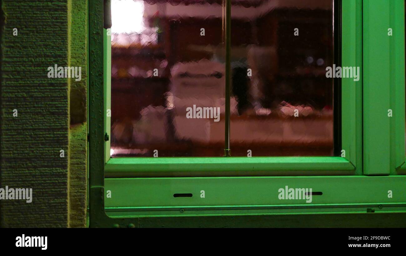 Window with green frame at night Stock Photo - Alamy