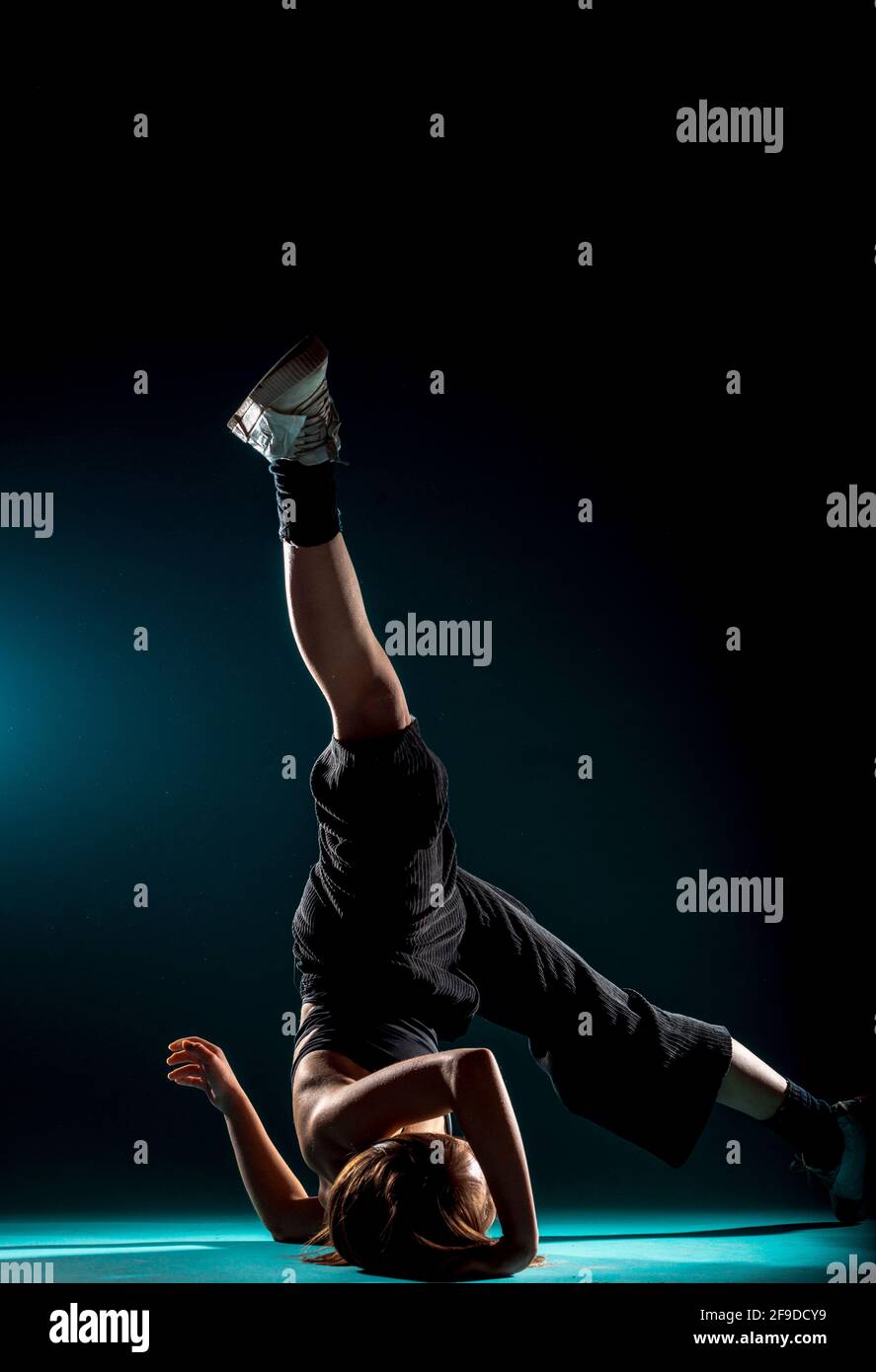 Dance moves performed by an acrobatic flexible female dancer dancing in ...