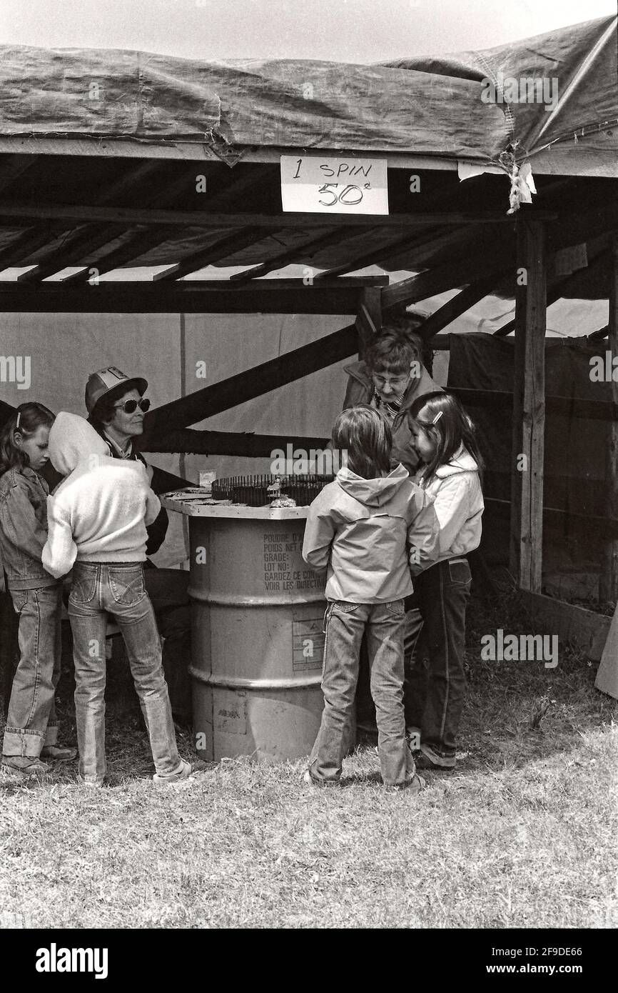 Children playing at a game of chance at the Dog Pound Rodeo and ...