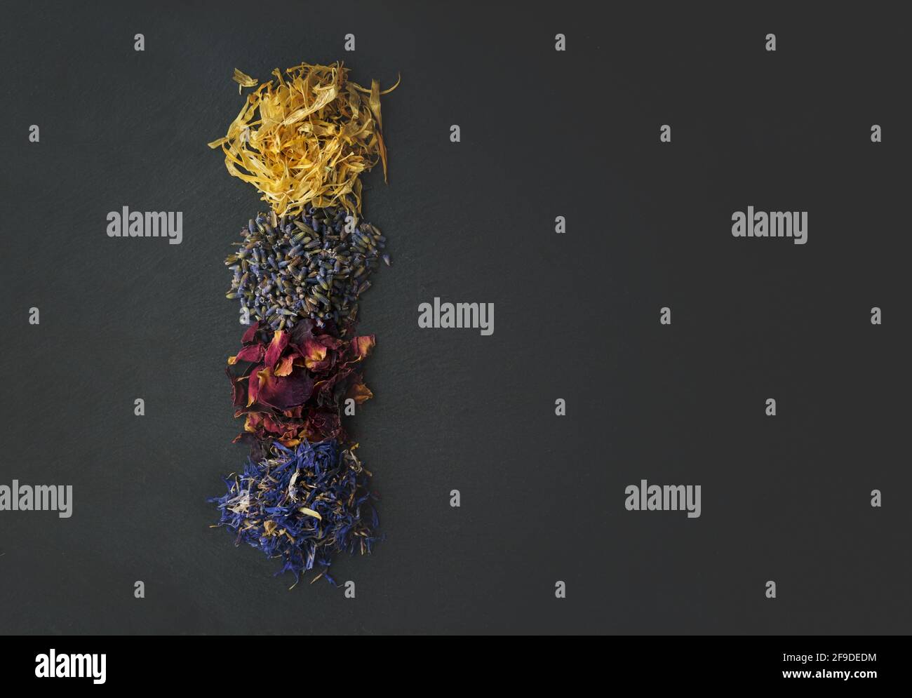 Top view of floral herbs - dried marigold, lavender, rose and ...